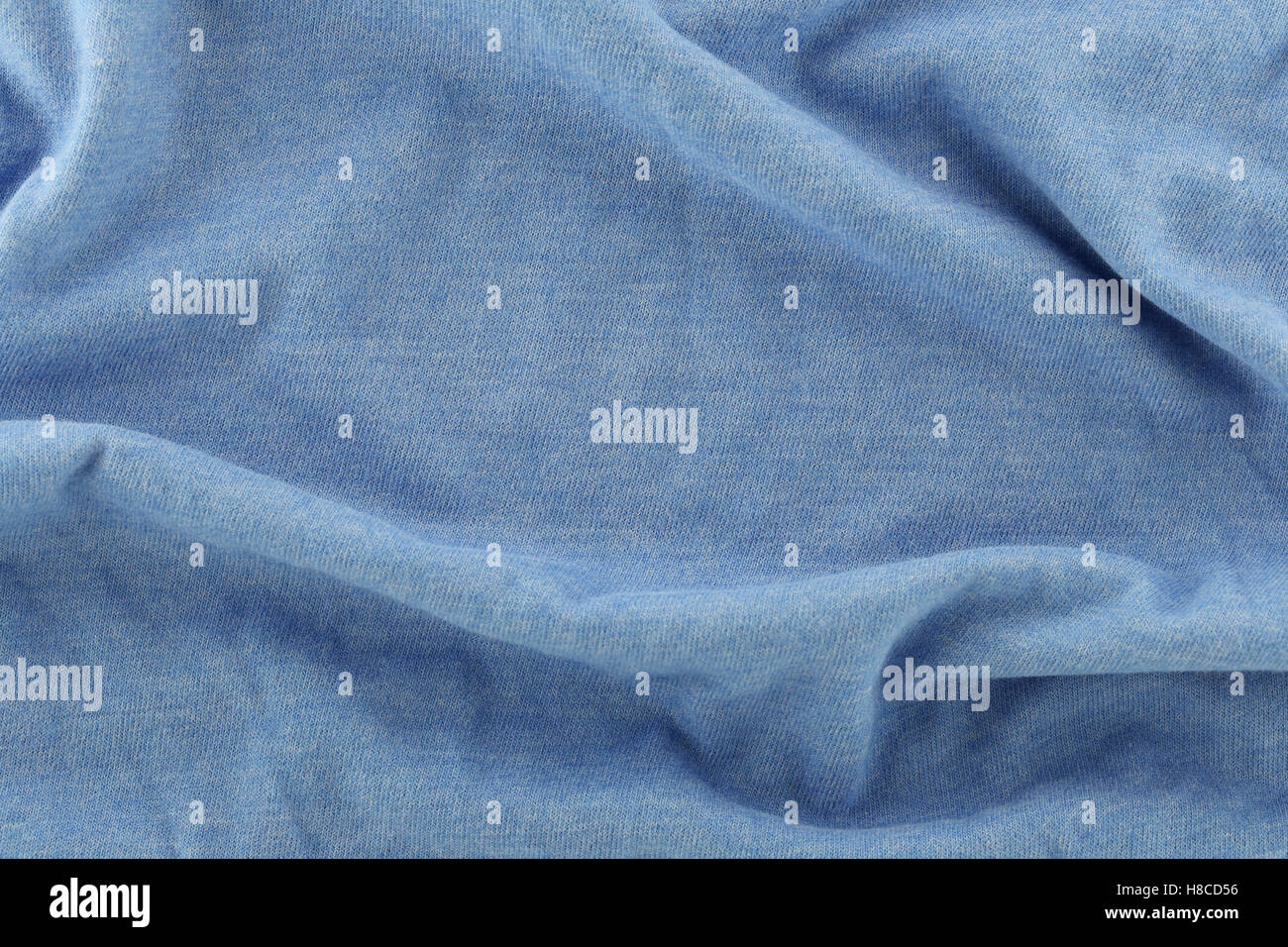 Closeup of rippled blue cotton fabric and have copy space to design ...