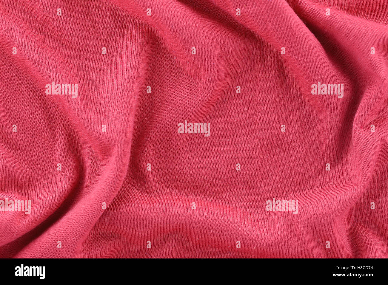Closeup of rippled red cotton fabric and have copy space to design ...