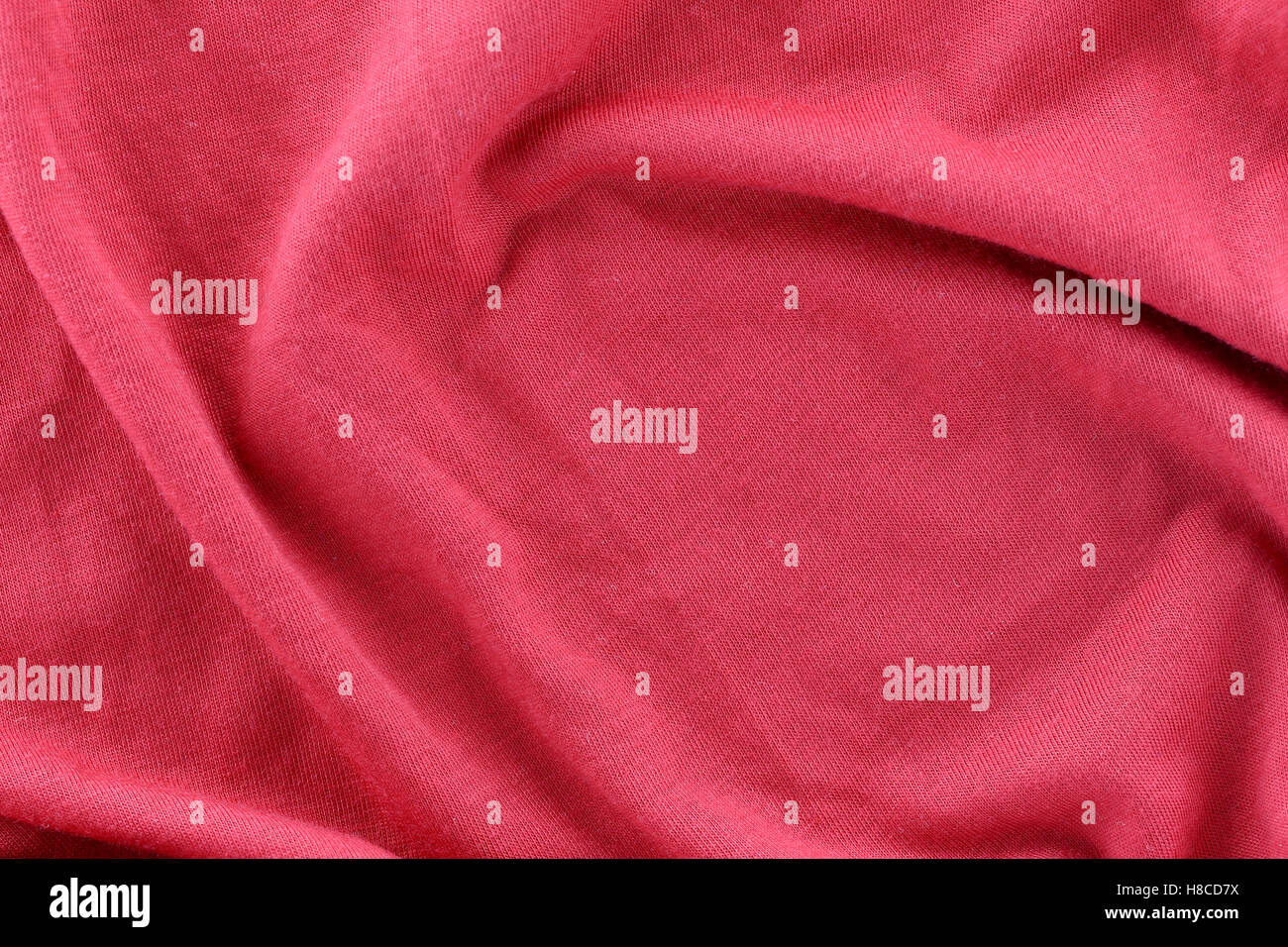Closeup of rippled red cotton fabric and have copy space to design ...