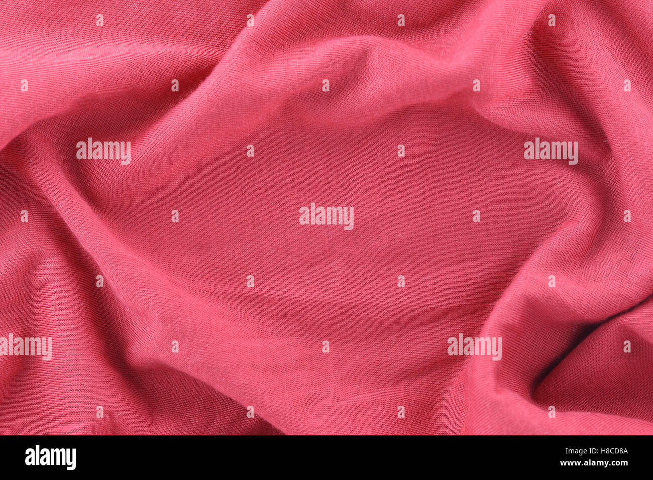 Closeup of rippled red cotton fabric and have copy space to design ...