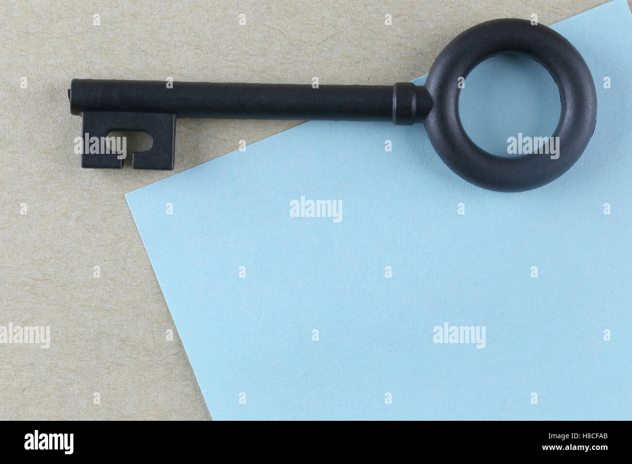 Black Plastic key is placed on Blue Paper Note and can input text to it ...