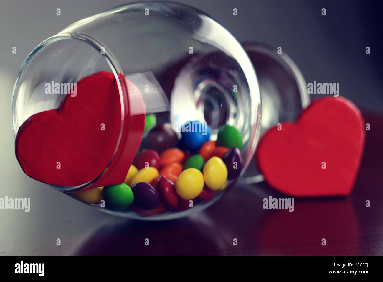 glass with candy pill Stock Photo - Alamy
