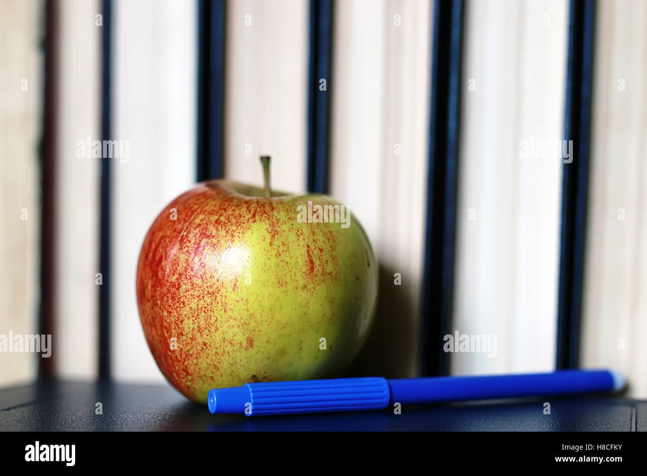 grunge effect photo education book stack apple pen Stock Photo - Alamy