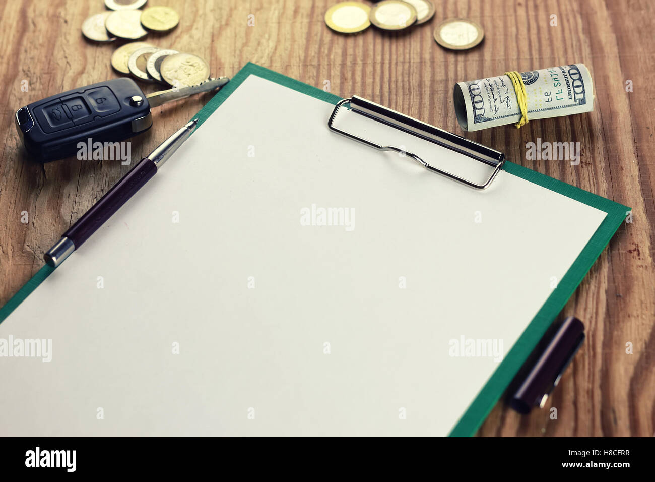 key money coin and empty paper Stock Photo - Alamy
