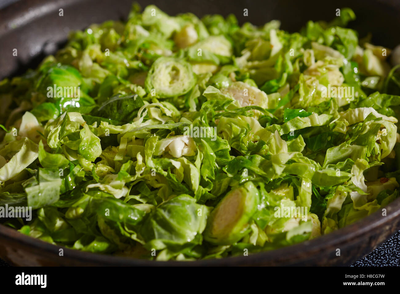 sliced brussels sprouts frying in a skillet Stock Photo - Alamy