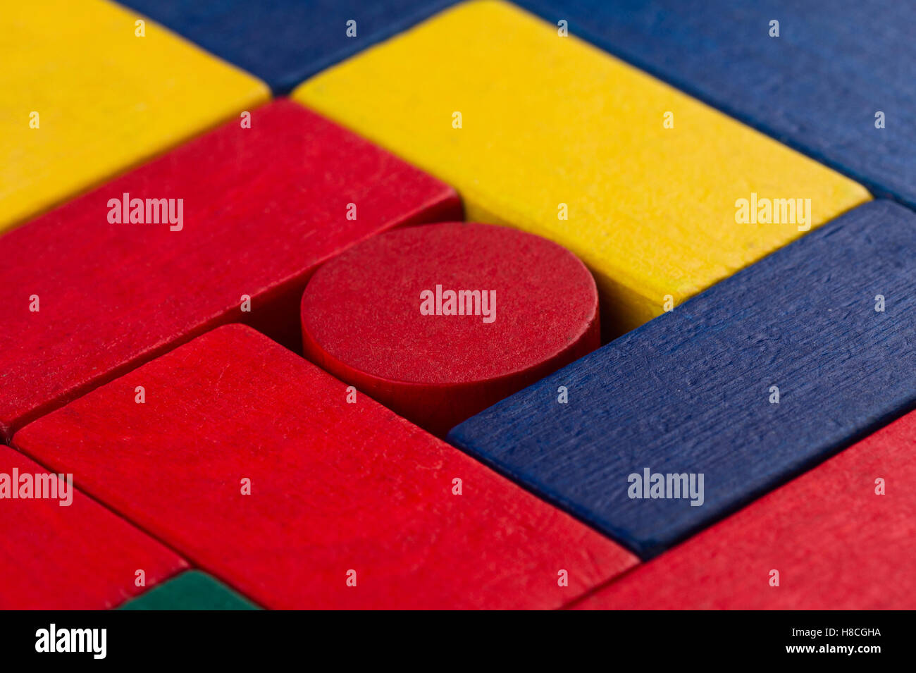abstract color composition with square wood toy building blocks and a ...