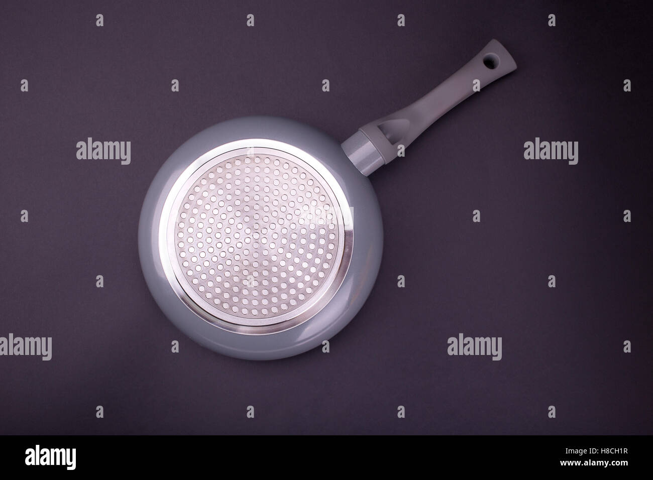 clean empty pan back side on a black background top view Stock Photo ...