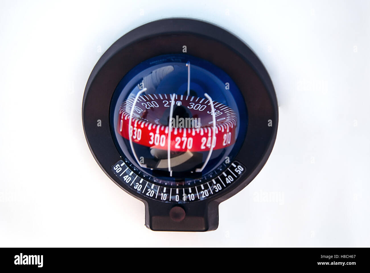 Compass on a yacht on white background Stock Photo - Alamy