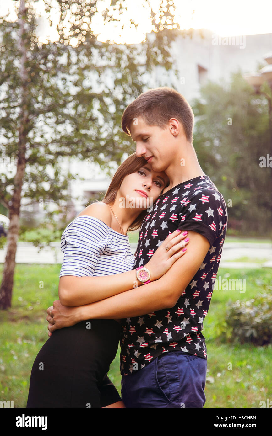 boyfriend hugging his girlfriend she laid her head on his shoulder ...
