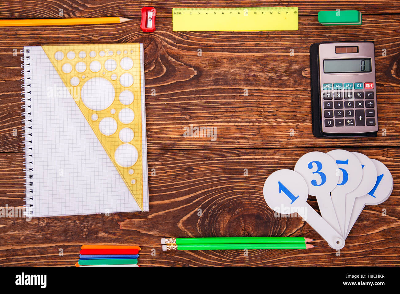 Blank notebook, ruler from the top, frame of school supplies over a ...