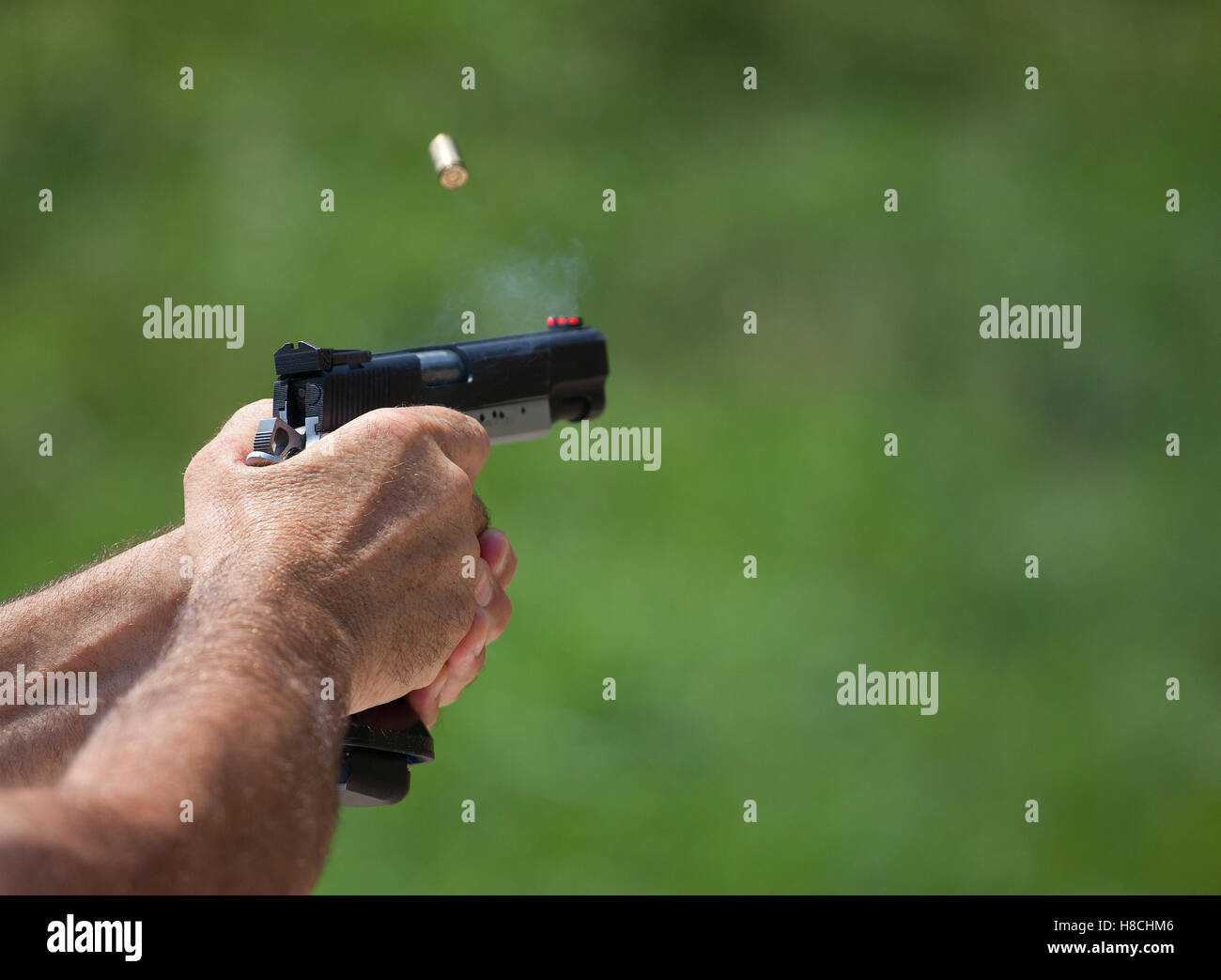 Handgun that has just delivered a single shot Stock Photo - Alamy
