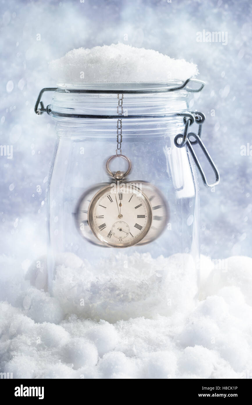 Pocket watch showing midnight on Christmas Eve with snowfall Stock ...