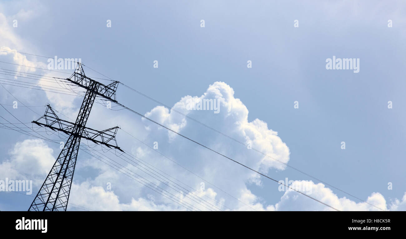 Unusual tilted composition of power lines and cloudscape on blue sky Stock Photo - Alamy