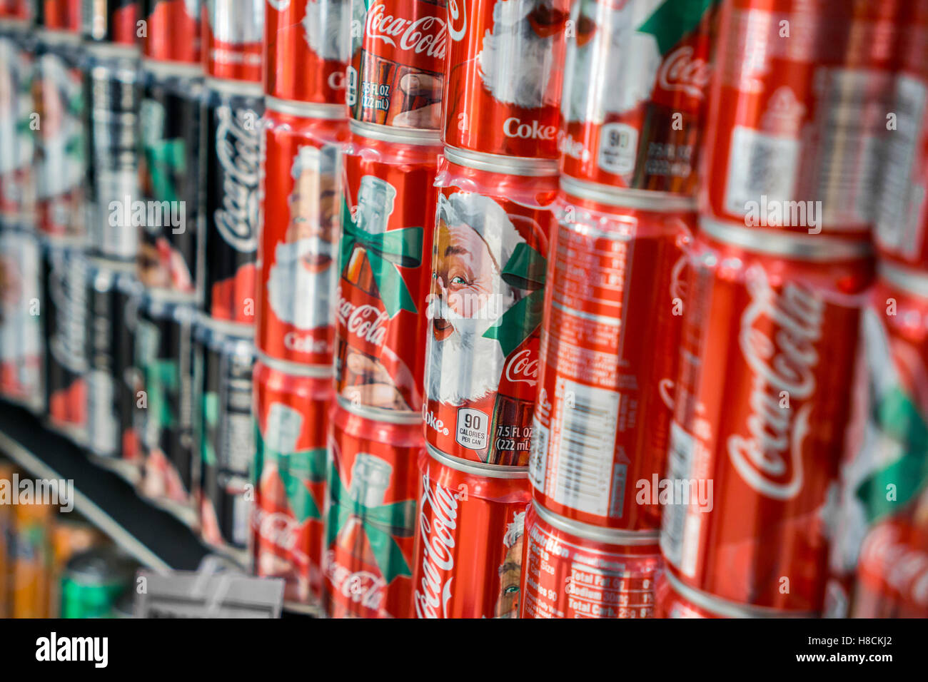 Six-packs of mini-cans of Coca-Cola featuring jolly old Santa Claus in ...