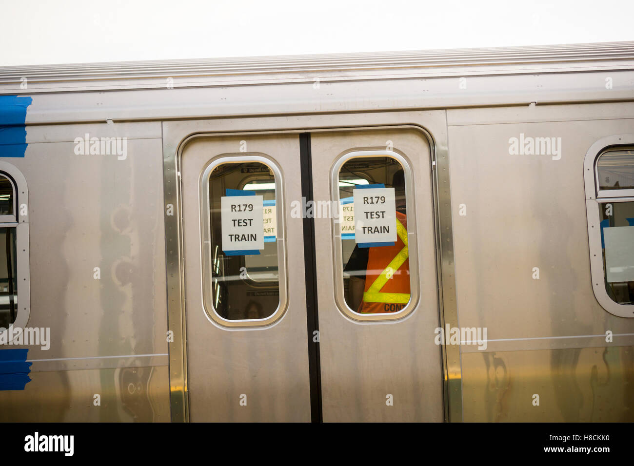 A test train consisting of new R179 subway cars runs along the elevated ...