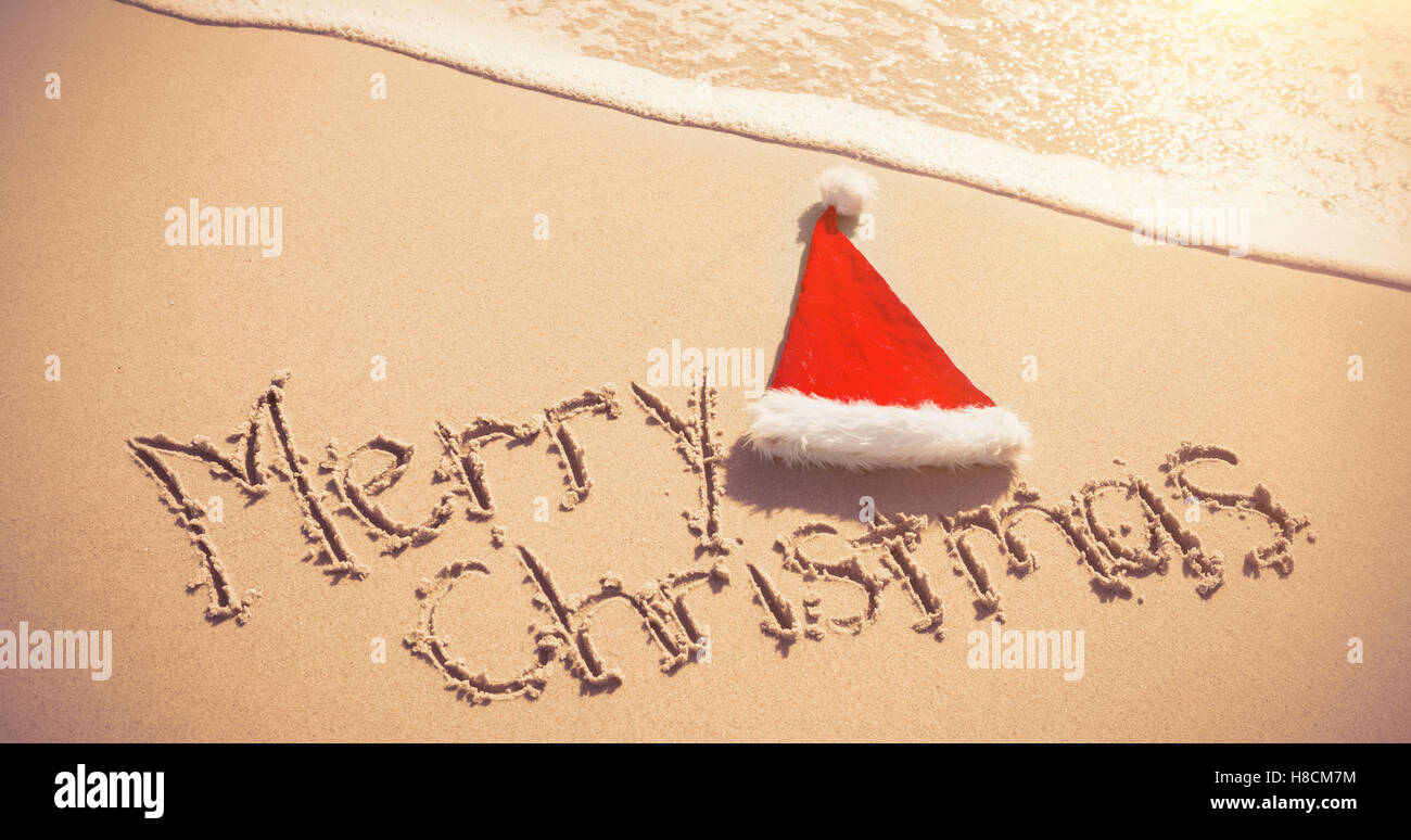 Merry christmas written on sand hi-res stock photography and images - Alamy