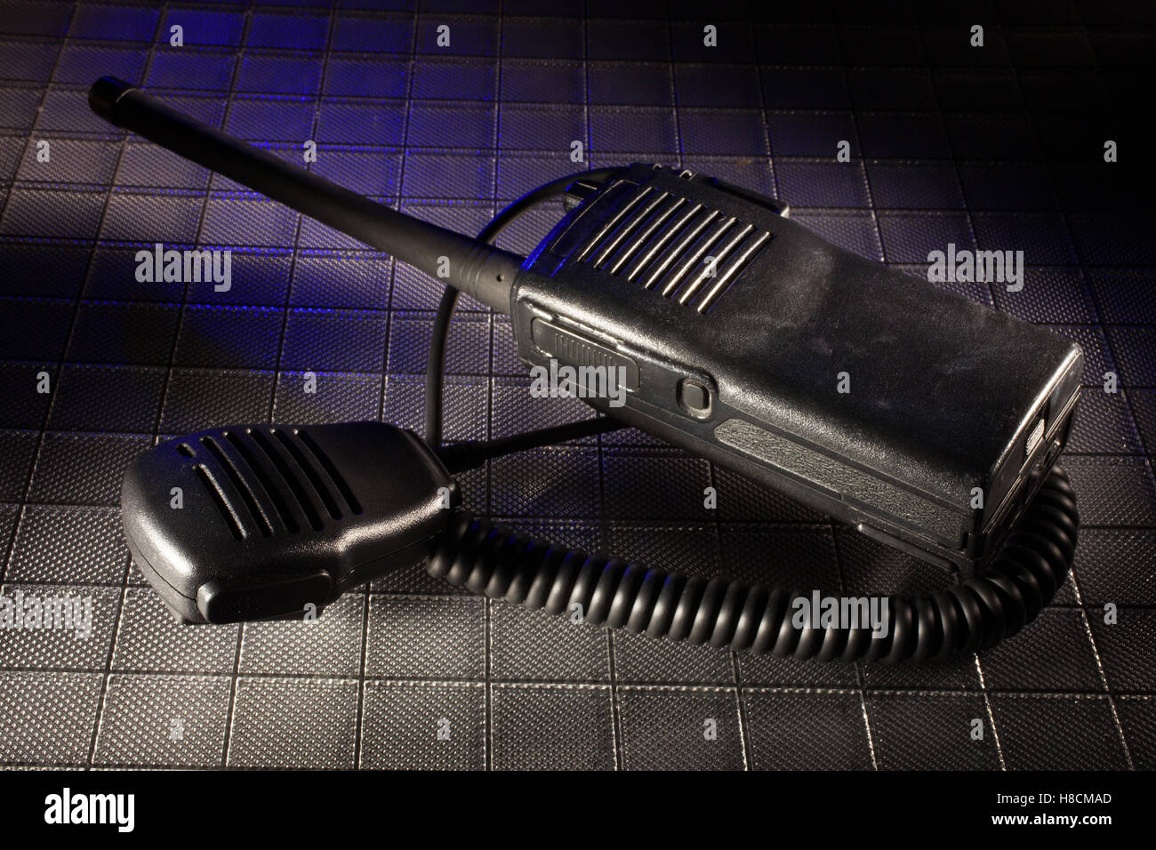 Two way radio and microphone on a textured background Stock Photo - Alamy