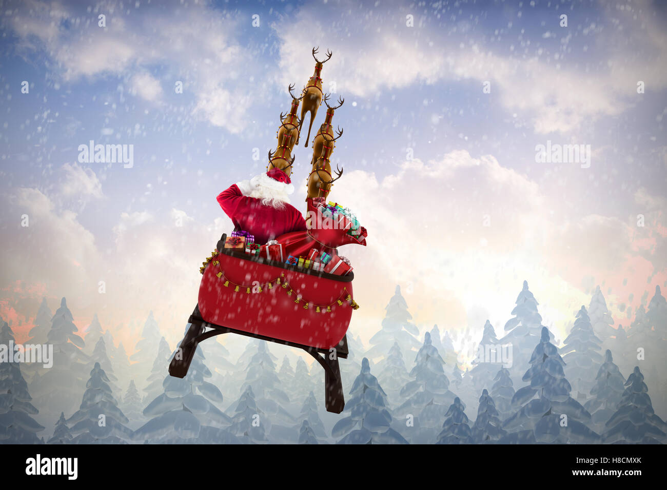 Composite image of rear view of santa claus riding on sled Stock Photo ...