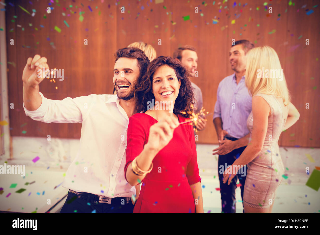 Composite image of smiling friends standing together Stock Photo - Alamy