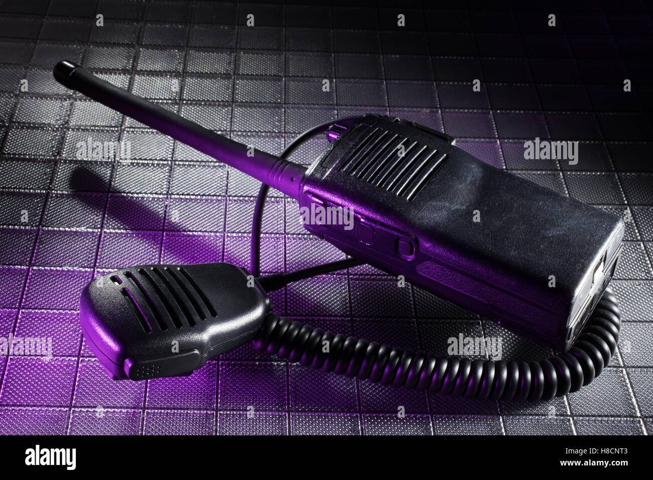 Two way radio on a textured background with purple lighting Stock Photo ...