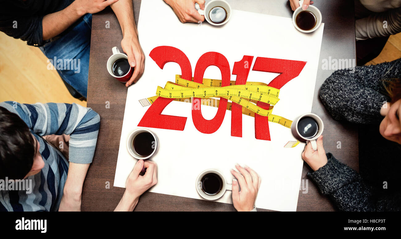 Composite image of people sitting around table drinking coffee Stock ...