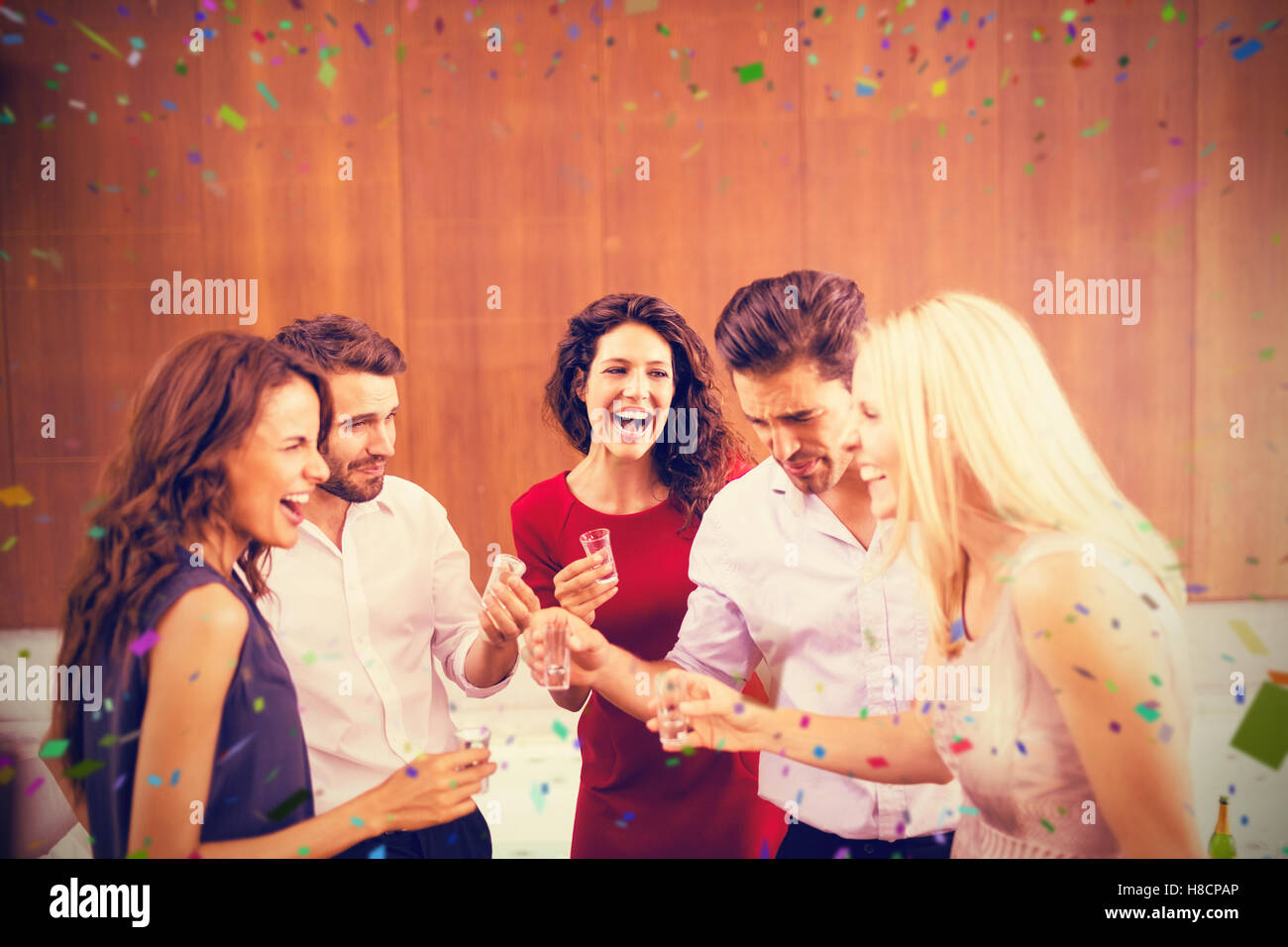 Group of friends standing head together hi-res stock photography and ...