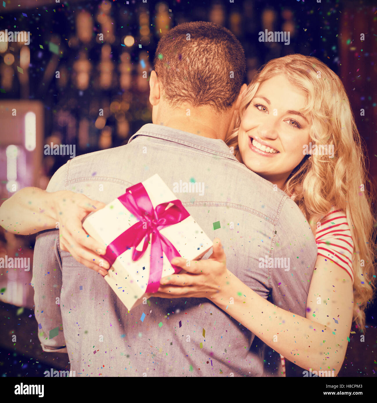 Young woman hugging gift box hi-res stock photography and images - Alamy