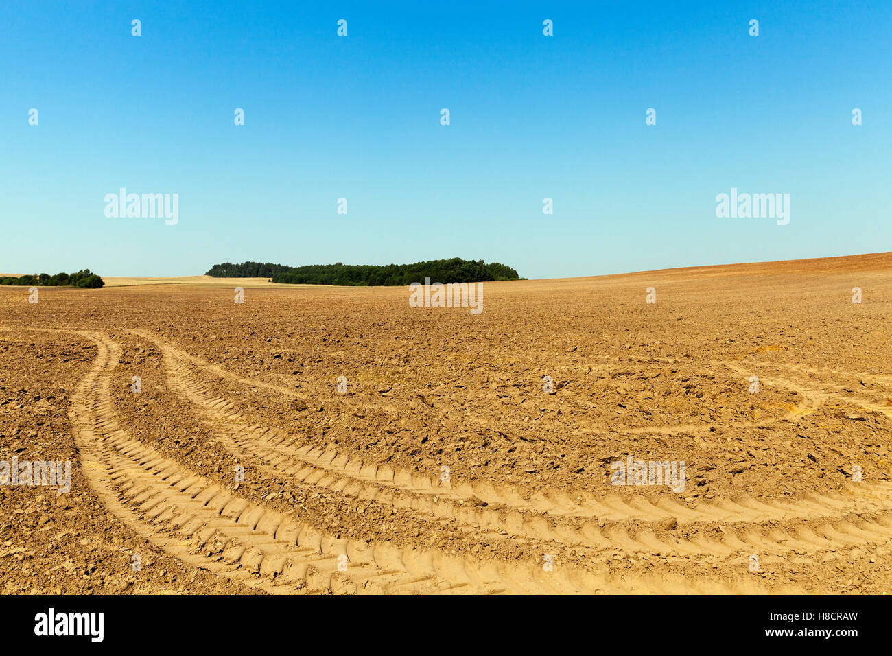 Wheel tracks on the field Stock Photo - Alamy