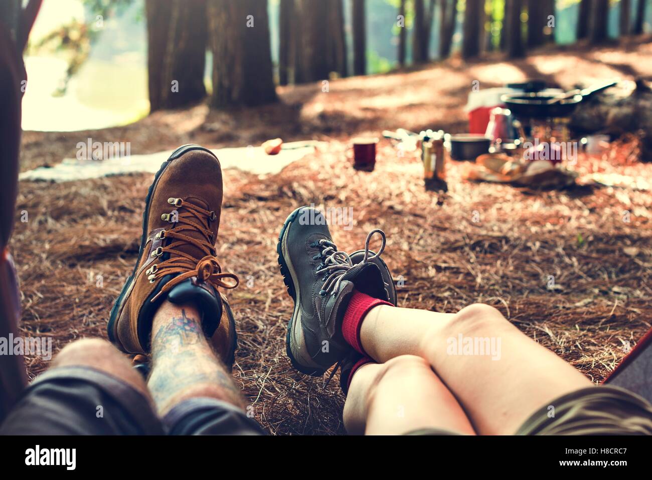 Couple Legs Relaxing Camping Outdoors Concept Stock Photo - Alamy