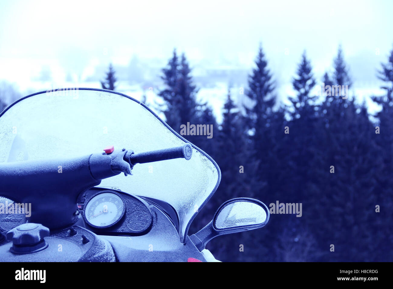 Side view of Snowmobile in winter mountains with forest Stock Photo - Alamy
