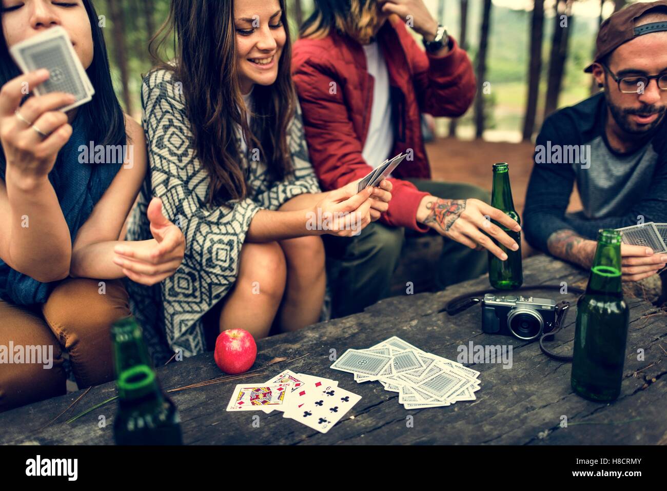 Friends Camping Playing Cards Concept Stock Photo - Alamy