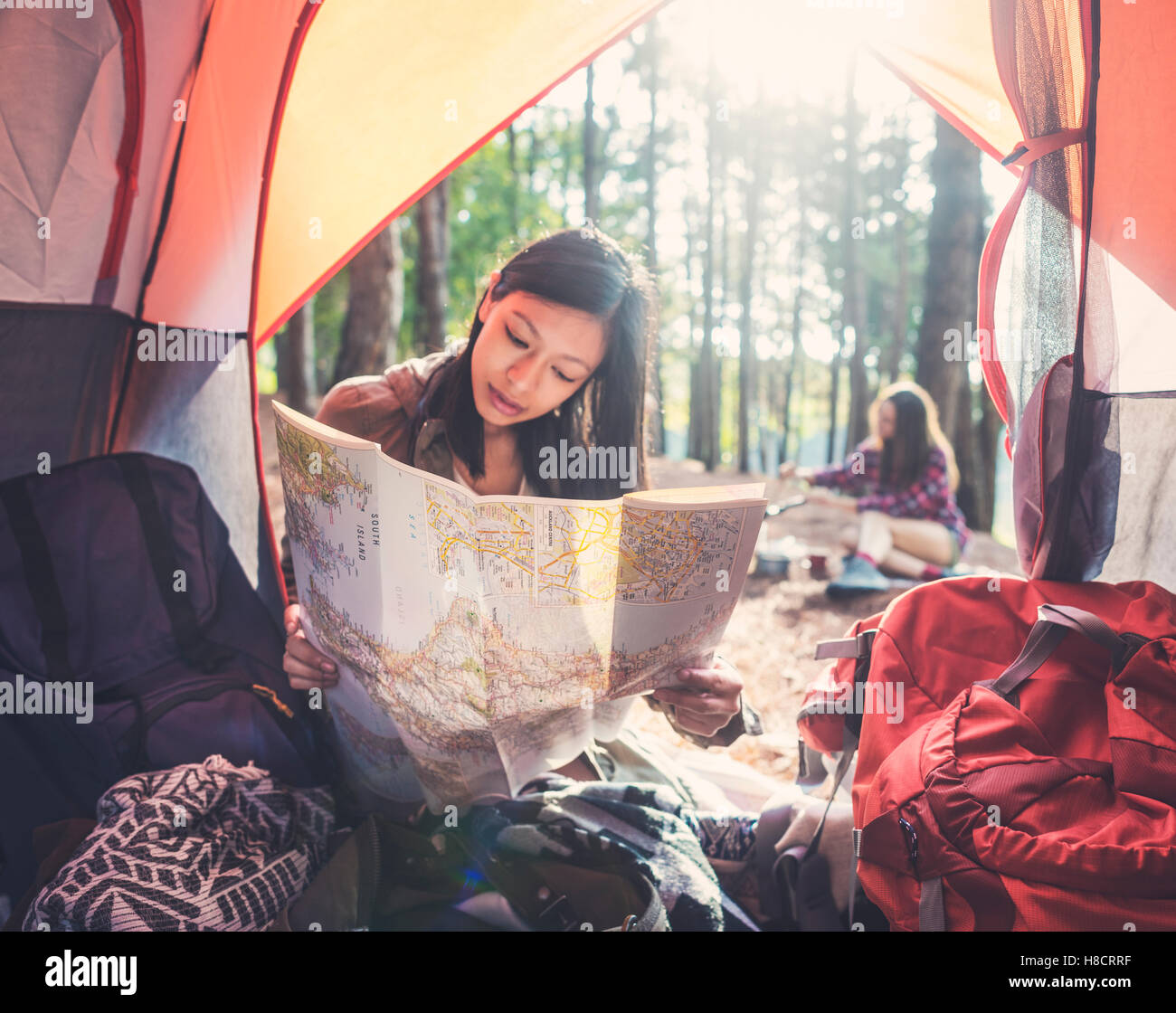 Girl Reading Map Traveling Destination Camping Concept Stock Photo - Alamy