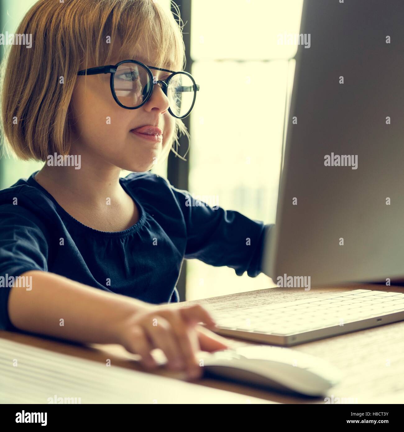 Little Girl Using Computer Concept Stock Photo - Alamy