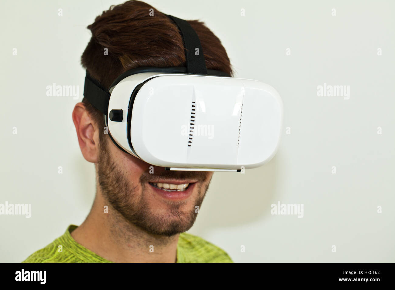 young male using virtual reality goggles for gaming Stock Photo - Alamy