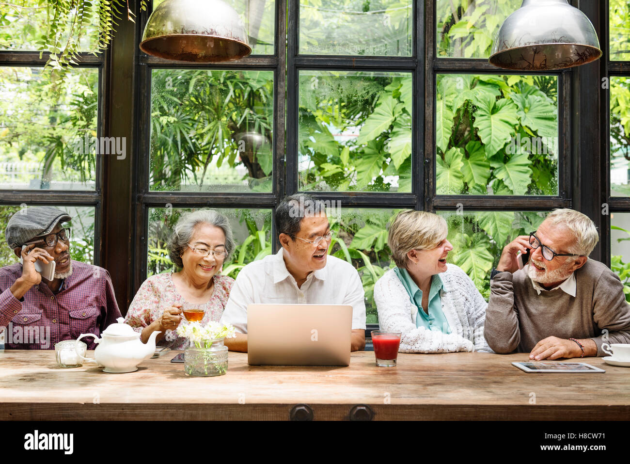 Senior Group Using Digital Device Relax Concept Stock Photo - Alamy