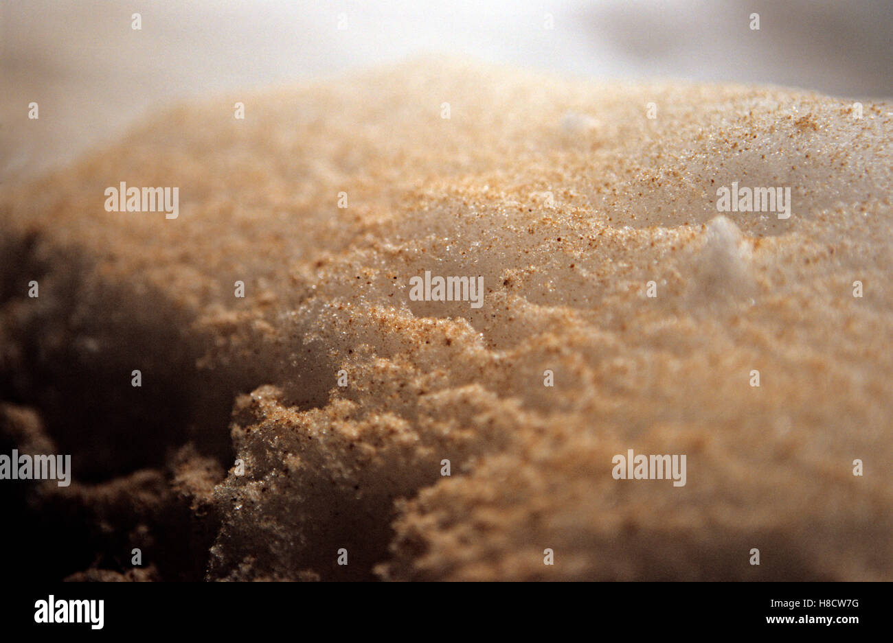 Close up of snow mixed with sand Stock Photo - Alamy