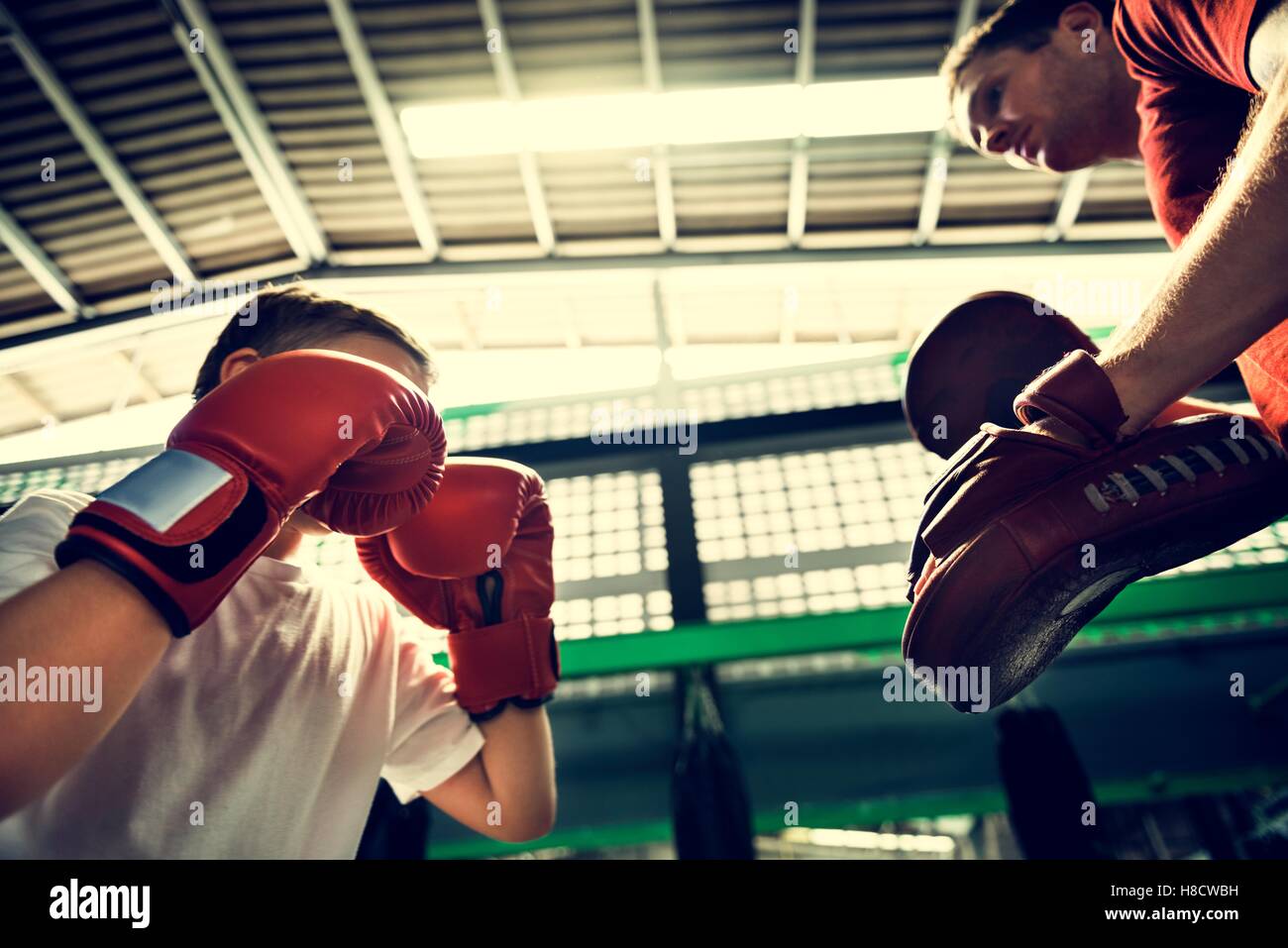 Boy training boxing exercise movement hi-res stock photography and ...