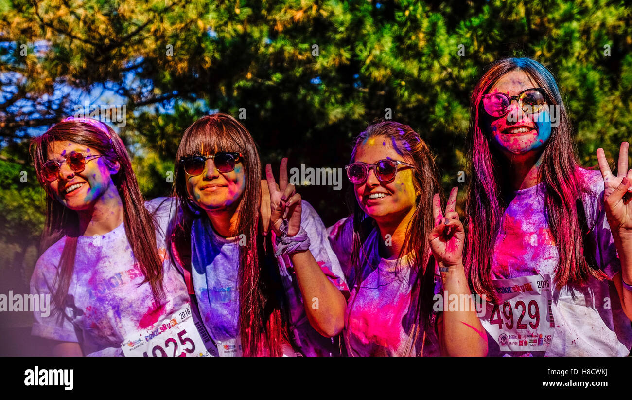 The youth celebrates with dance and colorful powders Stock Photo - Alamy