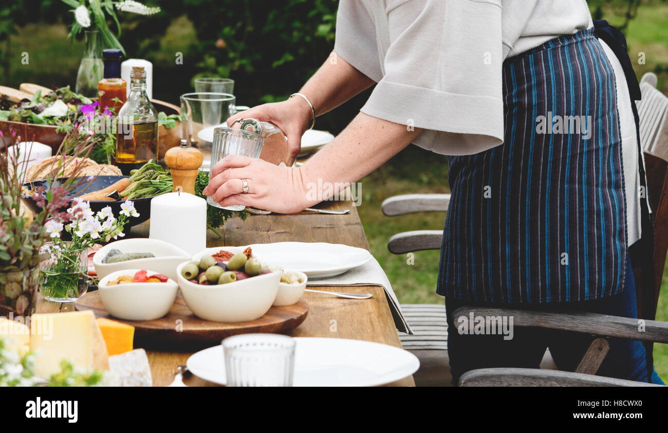 Woman Preparing Table Dinner Concept Stock Photo - Alamy