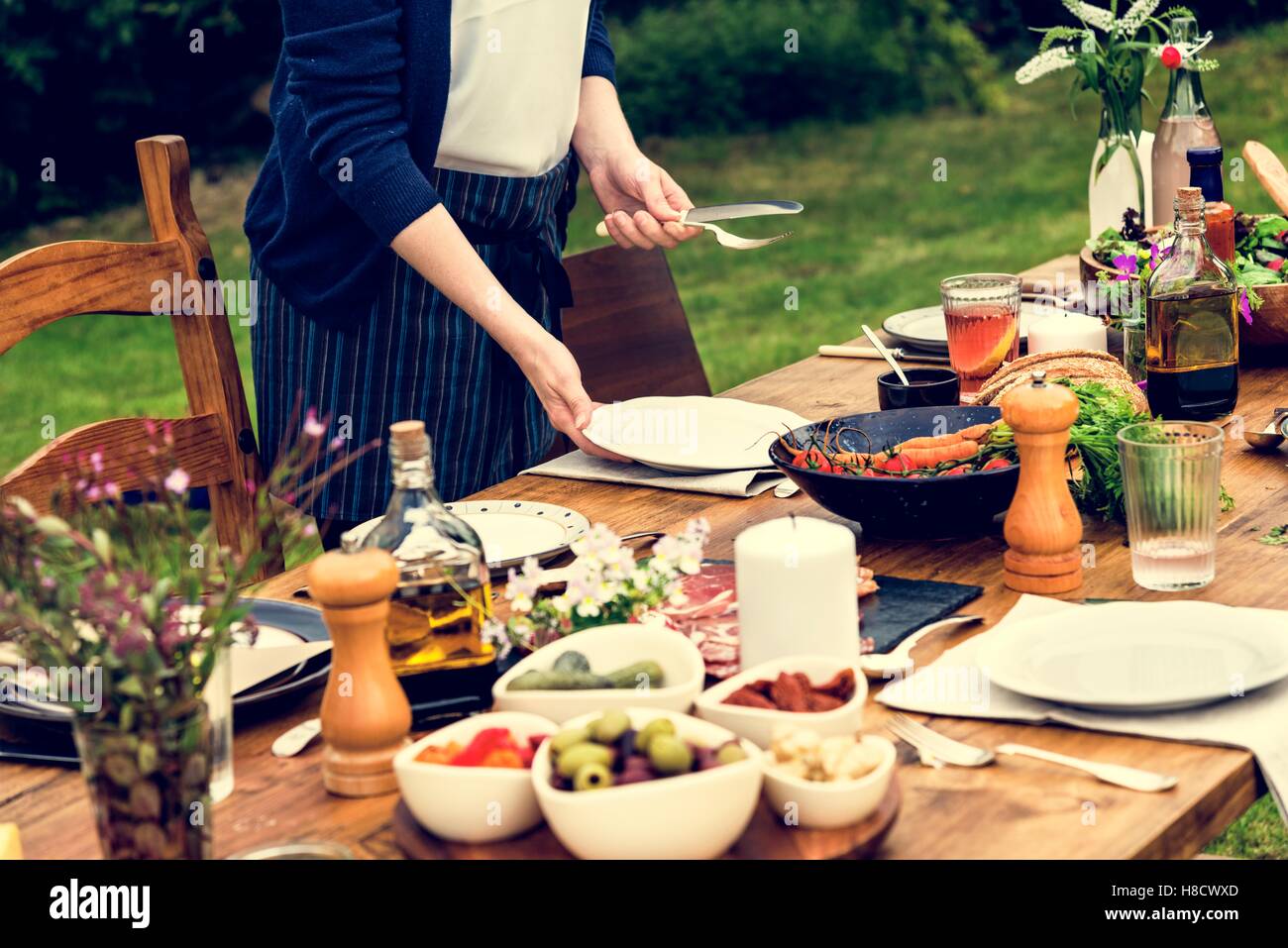Woman Preparing Table Dinner Concept Stock Photo - Alamy