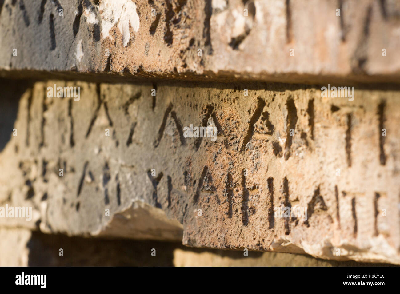 Inscription on old tomb in the Greek language. Characters, symbols ...