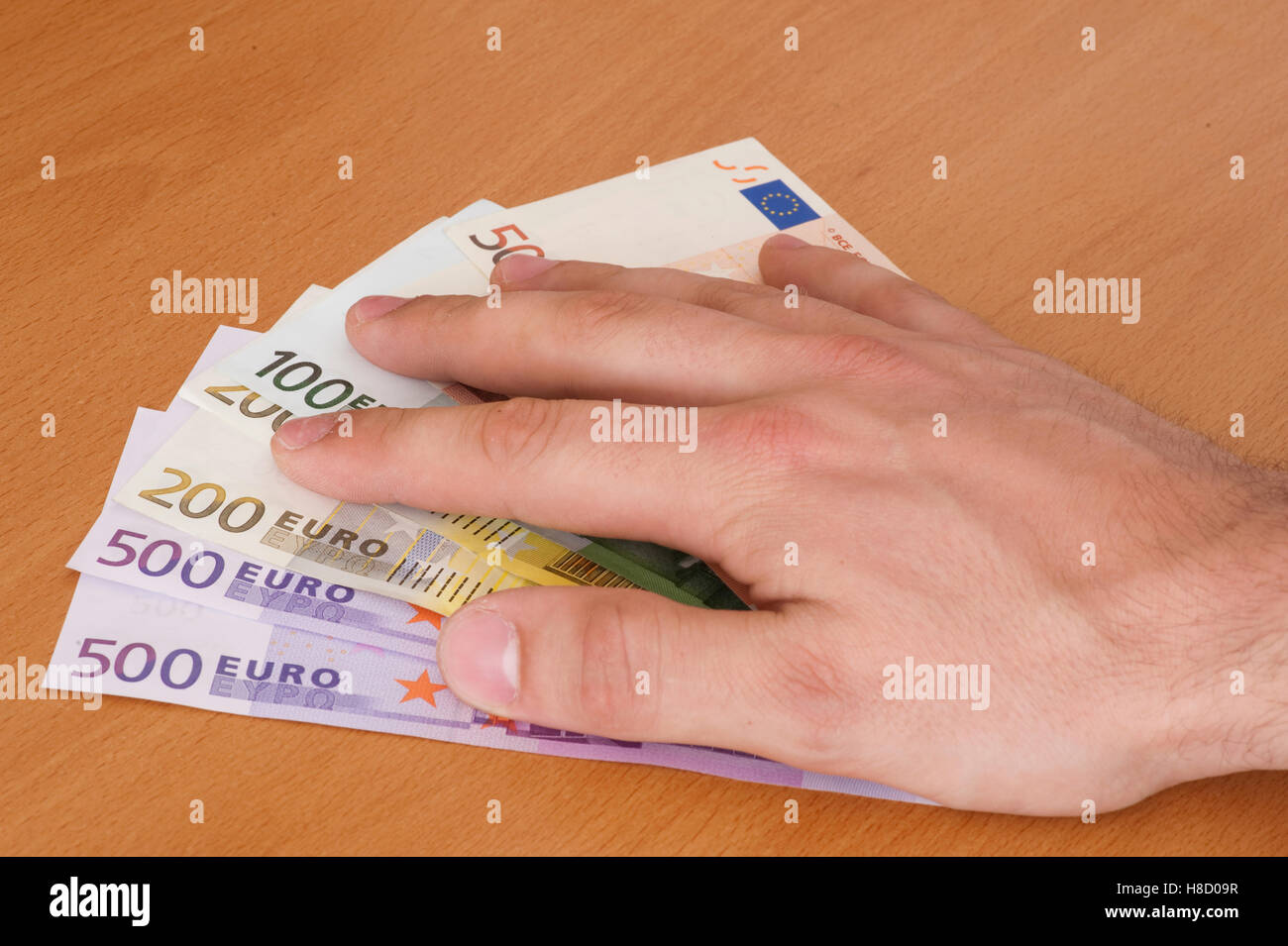 Hand clutching money hi-res stock photography and images - Alamy