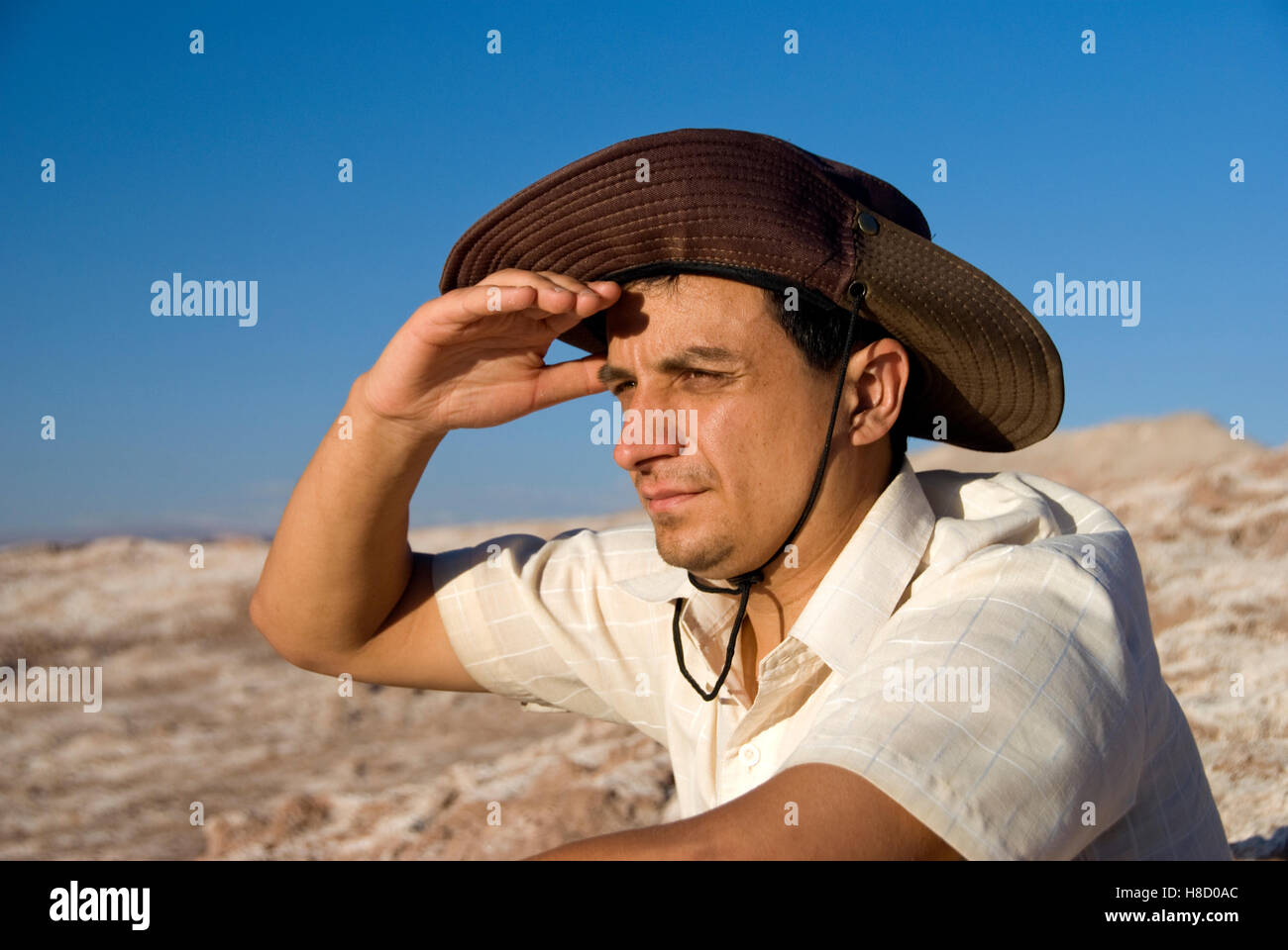 Young man, 25 +, looking out in the Atacama Desert, Chile, South ...