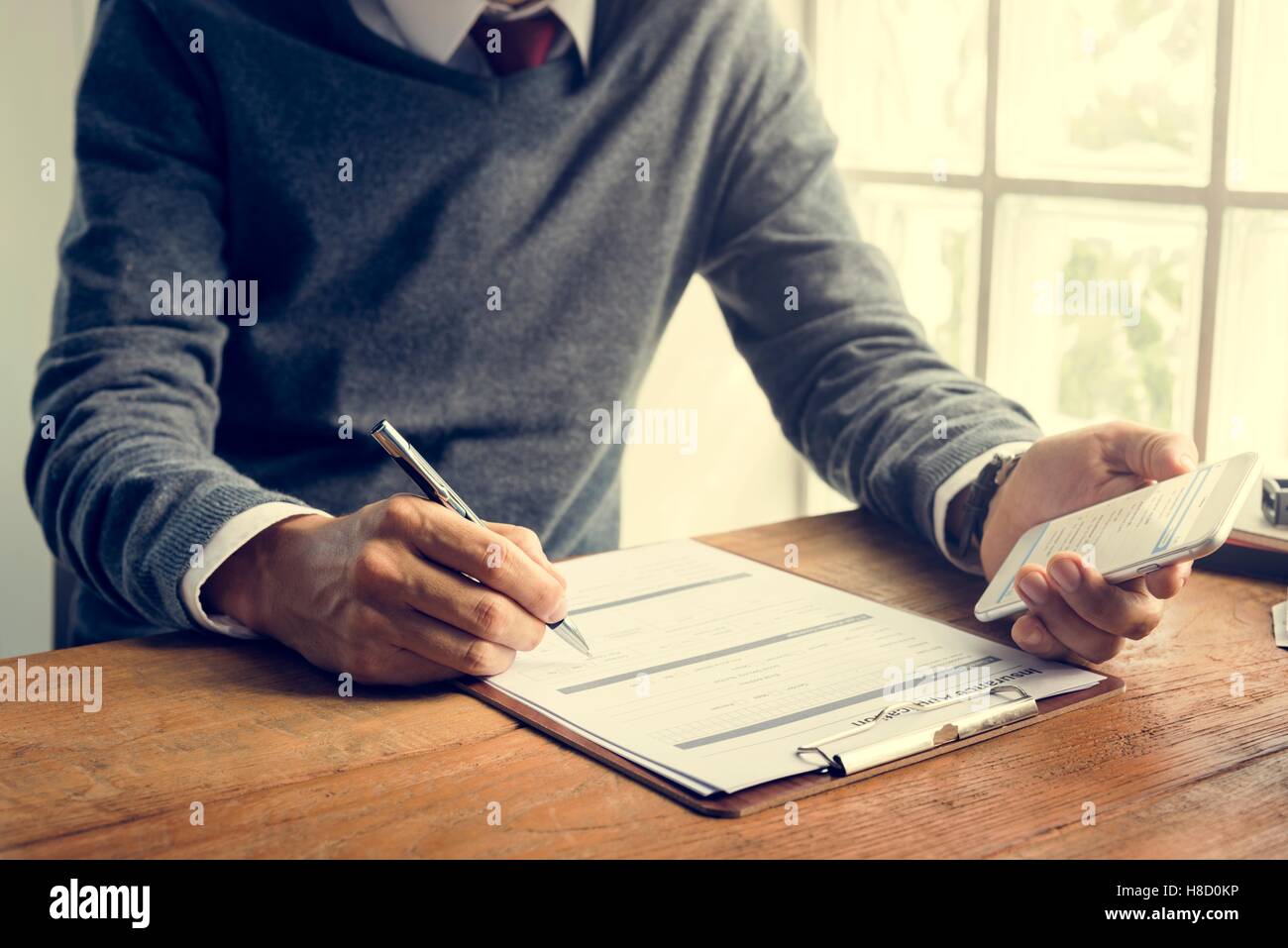 Man Writing Insurance Application Form Concept Stock Photo - Alamy