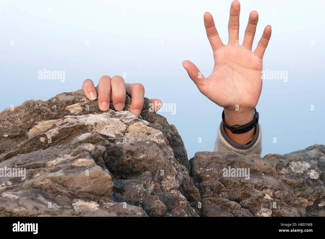 hand for help rock climbing Stock Photo - Alamy