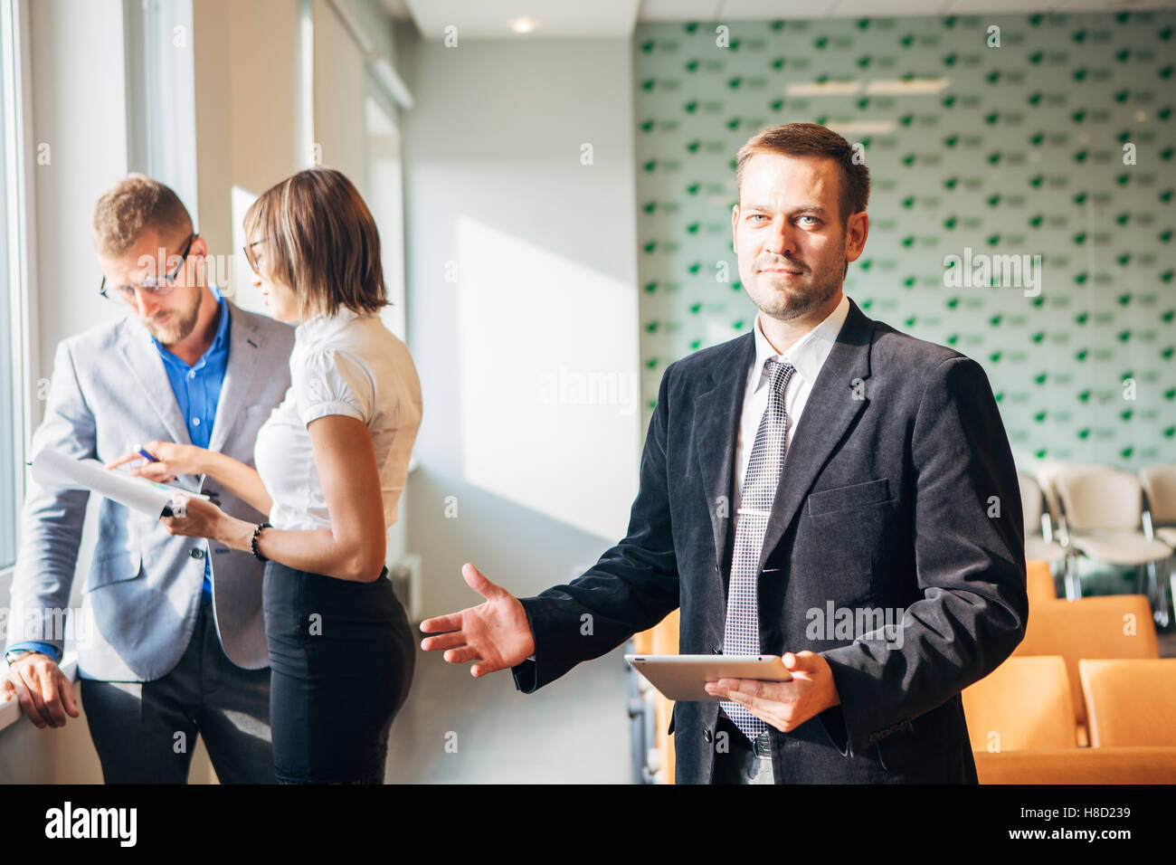 Three people office worker sitting hi-res stock photography and images ...