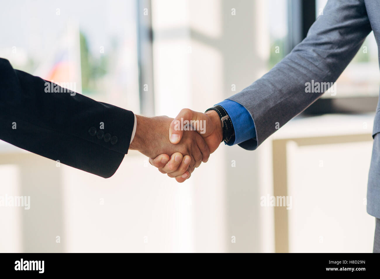 two businessman shake hands Stock Photo - Alamy