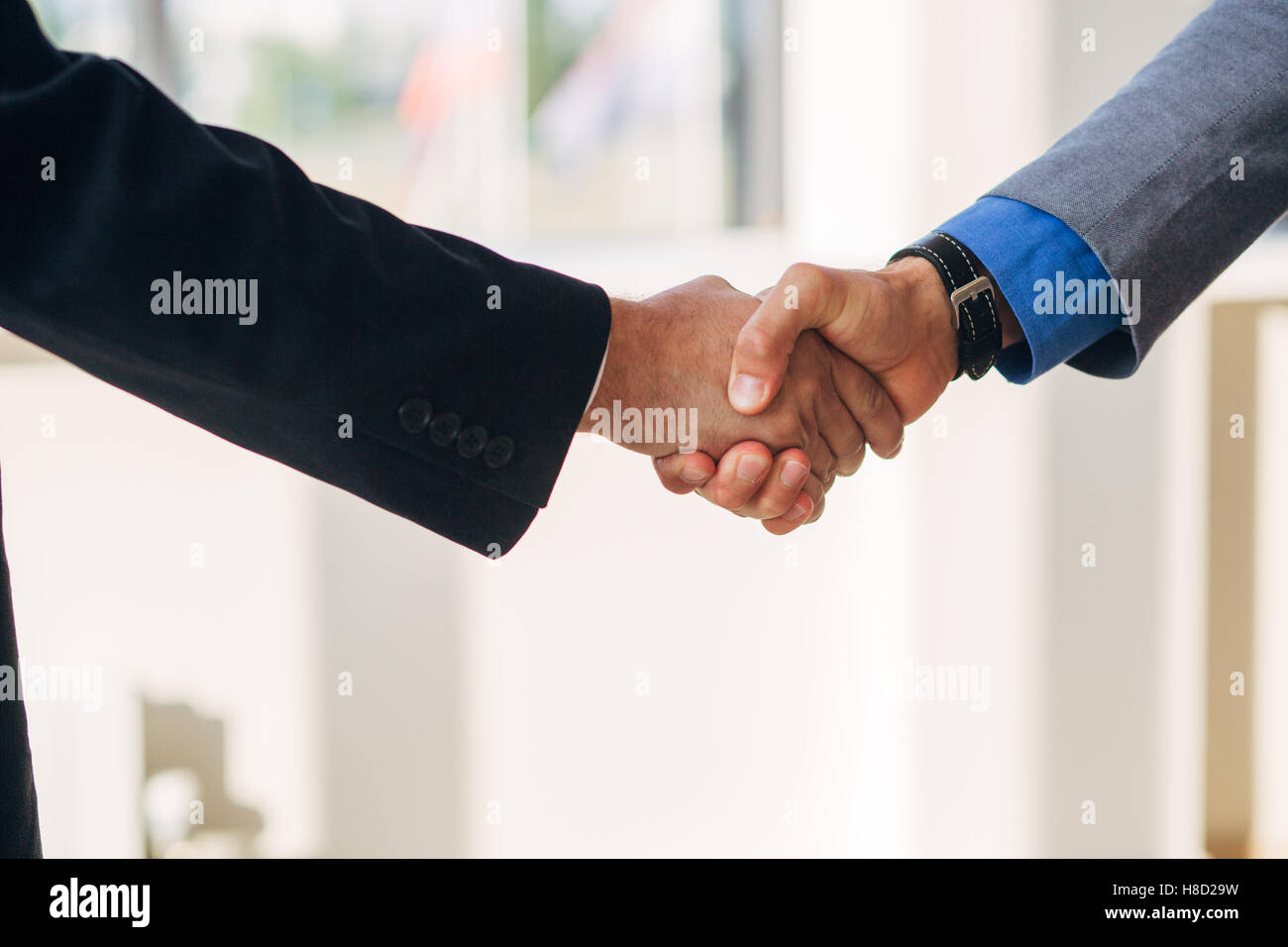 two businessman shake hands Stock Photo - Alamy