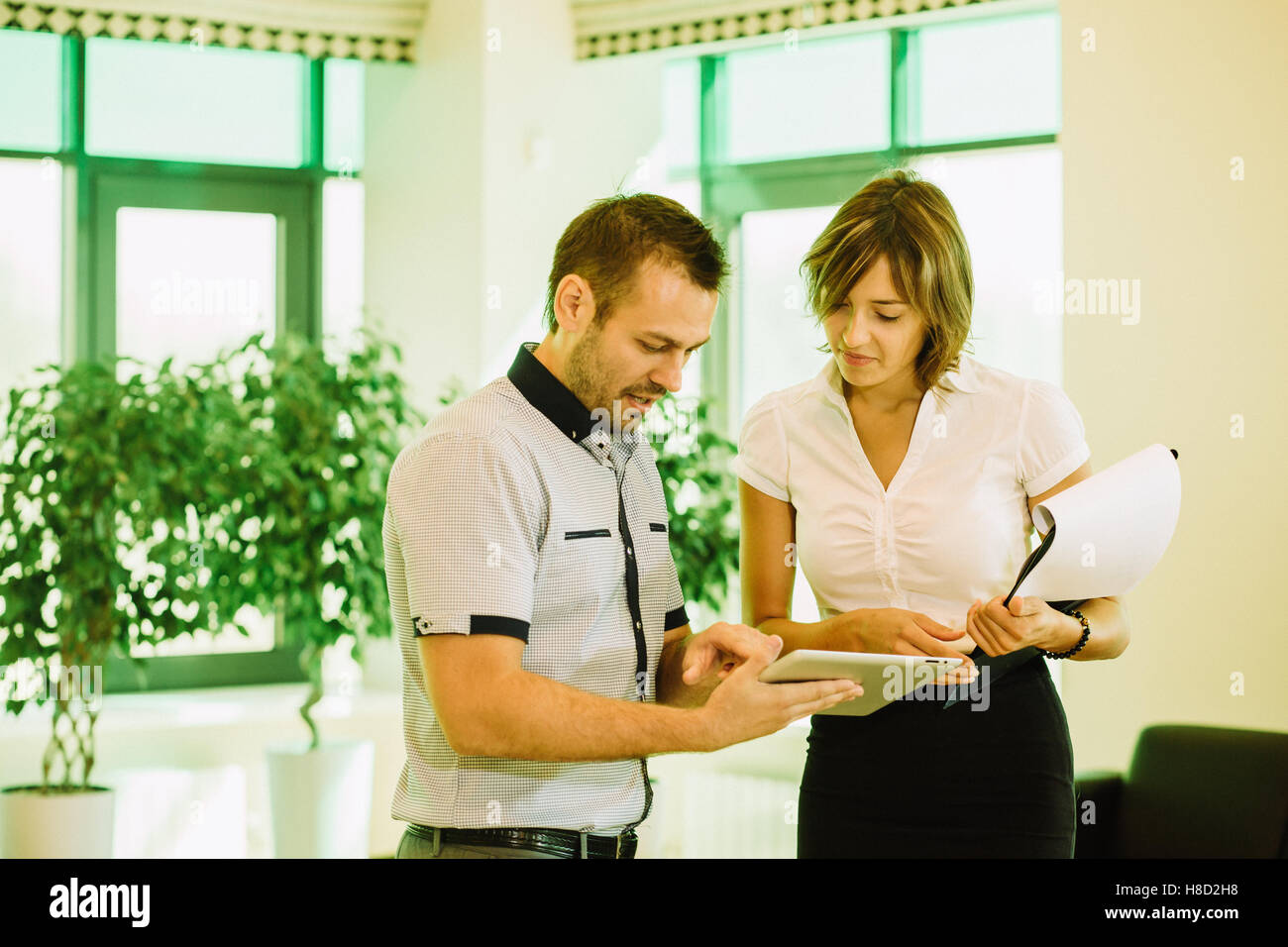 Business people discuss documents hi-res stock photography and images ...