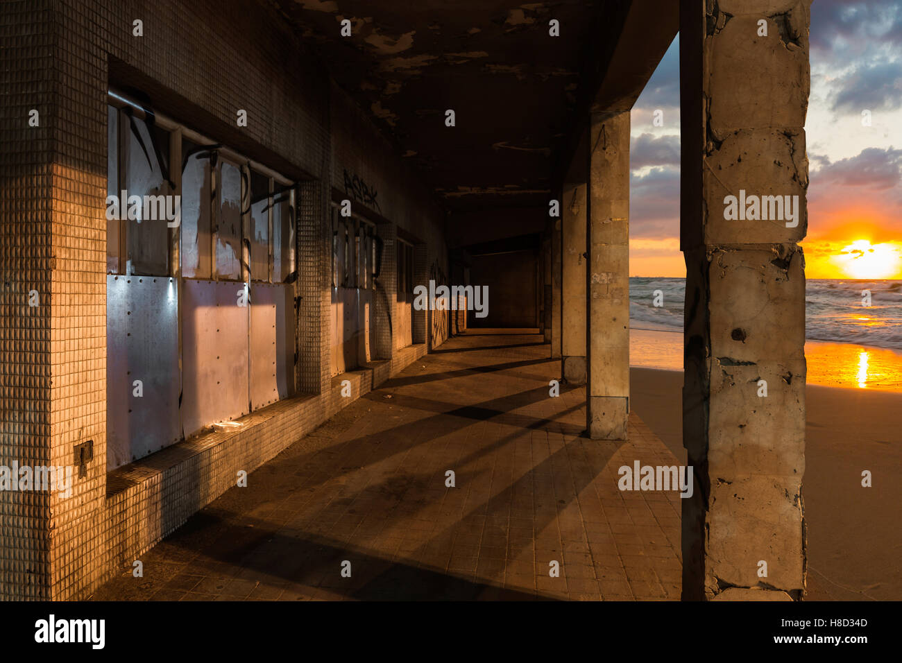 abandoned building on the beach with sunset Stock Photo - Alamy